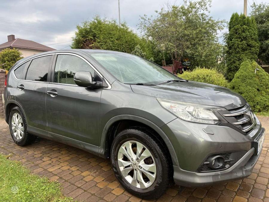 Grey Honda CR-V 2014 in Vilnius, with an engine capacity of 2.20 L and mileage of 269 thousand km for 10500 €, photo 1 on AUTOMOTO.COM.LV