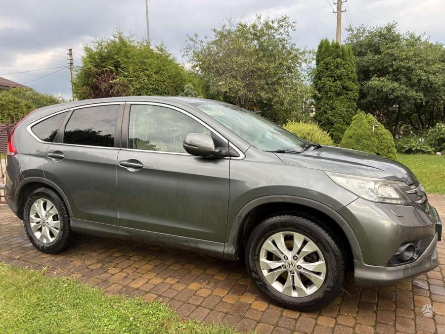 Grey Honda CR-V 2014 in Vilnius, with an engine capacity of 2.20 L and mileage of 269 thousand km for 10500 €, photo 4 on AUTOMOTO.COM.LV