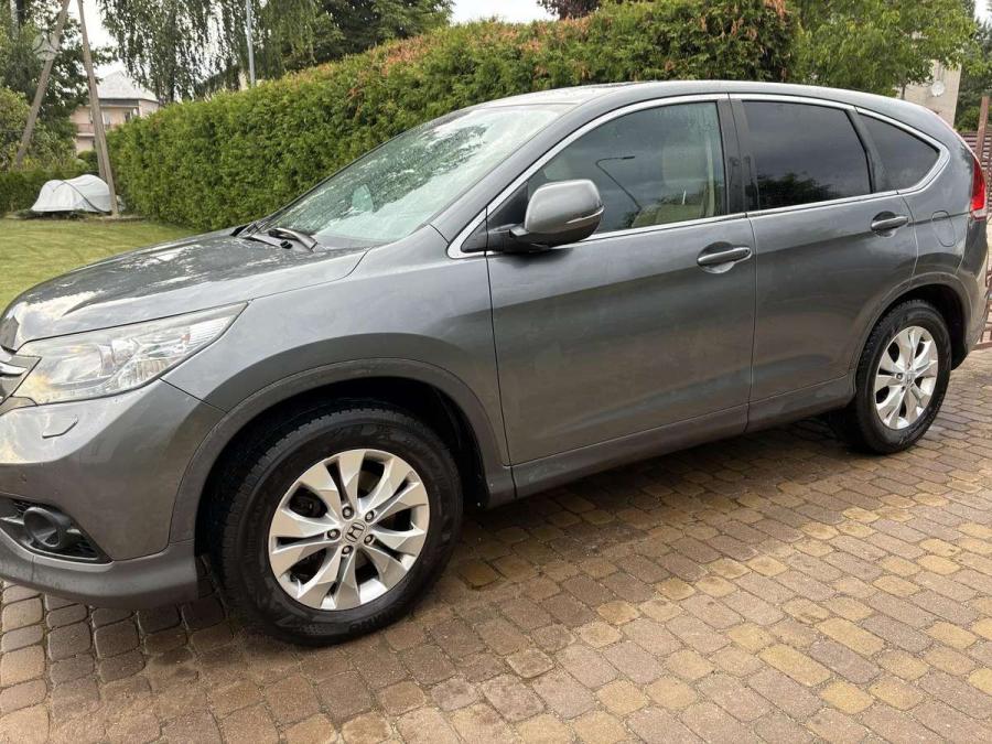 Grey Honda CR-V 2014 in Vilnius, with an engine capacity of 2.20 L and mileage of 269 thousand km for 10500 €, photo 9 on AUTOMOTO.COM.LV