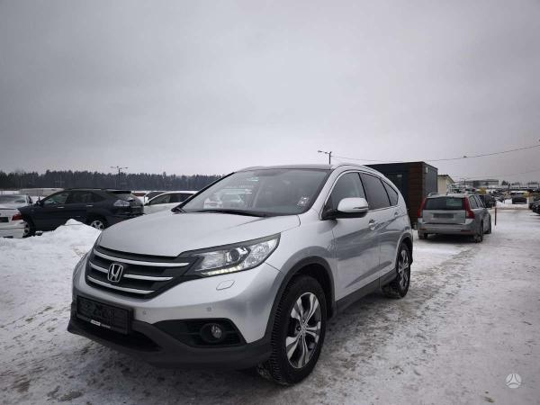 Grey Honda CR-V 2015 in Vilnius, with an engine capacity of 2.20 L and mileage of 215 thousand km for 11950 €, photo 1 on AUTOMOTO.COM.LV