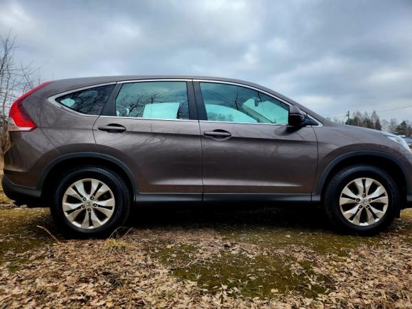 Grey Honda CR-V 2015 in Riga, with an engine capacity of 1.60 L and mileage of 238 thousand km for 10800 €, photo 9 on AUTOMOTO.COM.LV