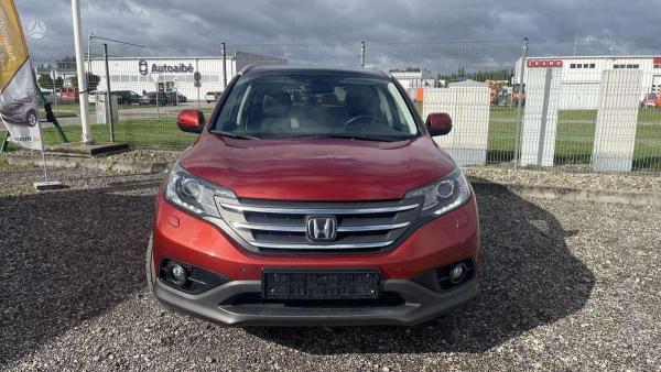 Orange Honda CR-V 2012 in Marijampole, with an engine capacity of 2.20 L and mileage of 219 thousand km for 9990 €, photo 7 on AUTOMOTO.COM.LV