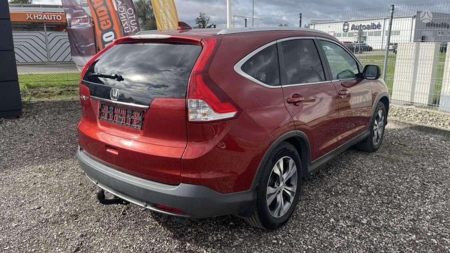 Orange Honda CR-V 2012 in Marijampole, with an engine capacity of 2.20 L and mileage of 219 thousand km for 9990 €, photo 13 on AUTOMOTO.COM.LV