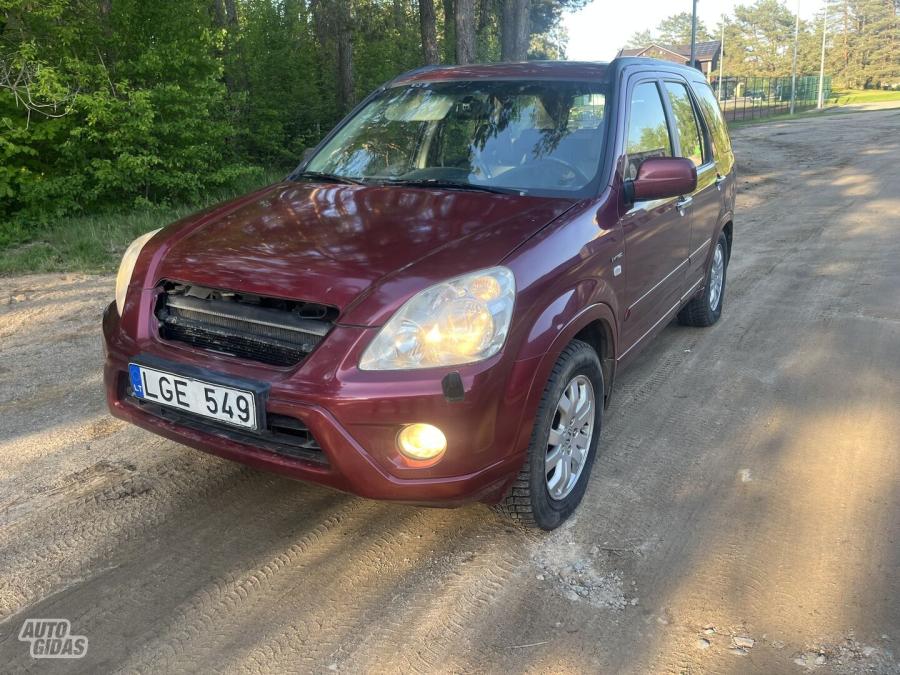 Red Honda CR-V 2006 in Ignalina, with an engine capacity of 2.00 L and mileage of 220 thousand km for 1650 €, photo 1 on AUTOMOTO.COM.LV