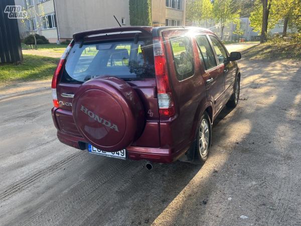 Red Honda CR-V 2006 in Ignalina, with an engine capacity of 2.00 L and mileage of 220 thousand km for 1650 €, photo 4 on AUTOMOTO.COM.LV
