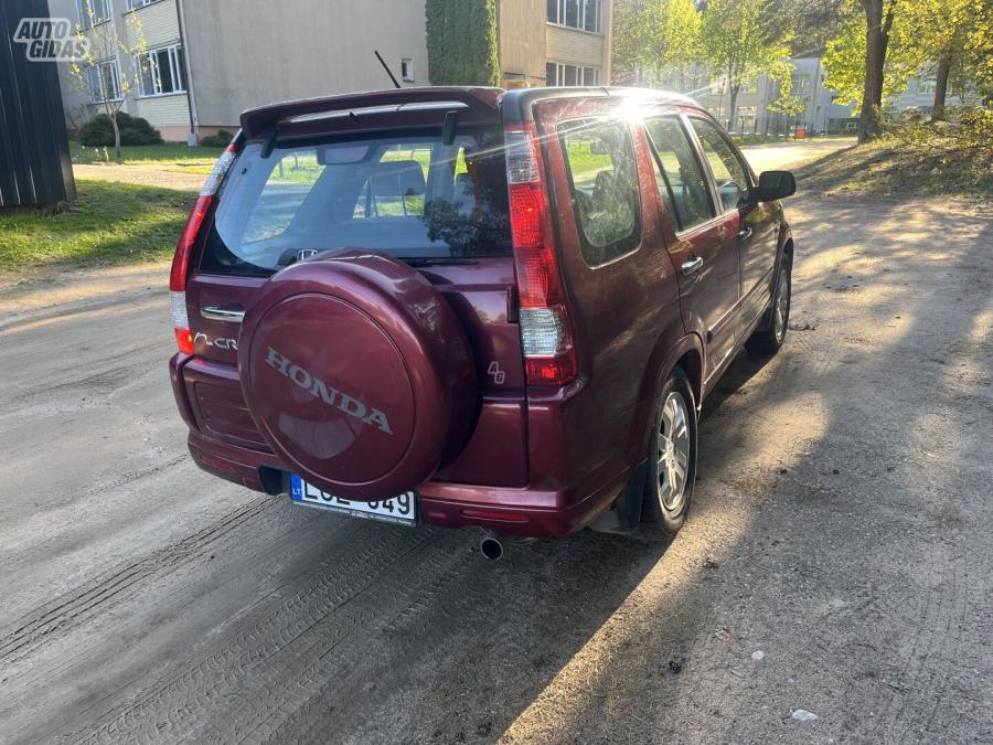 Red Honda CR-V 2006 in Ignalina, with an engine capacity of 2.00 L and mileage of 220 thousand km for 1650 €, photo 5 on AUTOMOTO.COM.LV