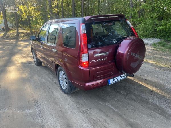 Red Honda CR-V 2006 in Ignalina, with an engine capacity of 2.00 L and mileage of 220 thousand km for 1650 €, photo 5 on AUTOMOTO.COM.LV