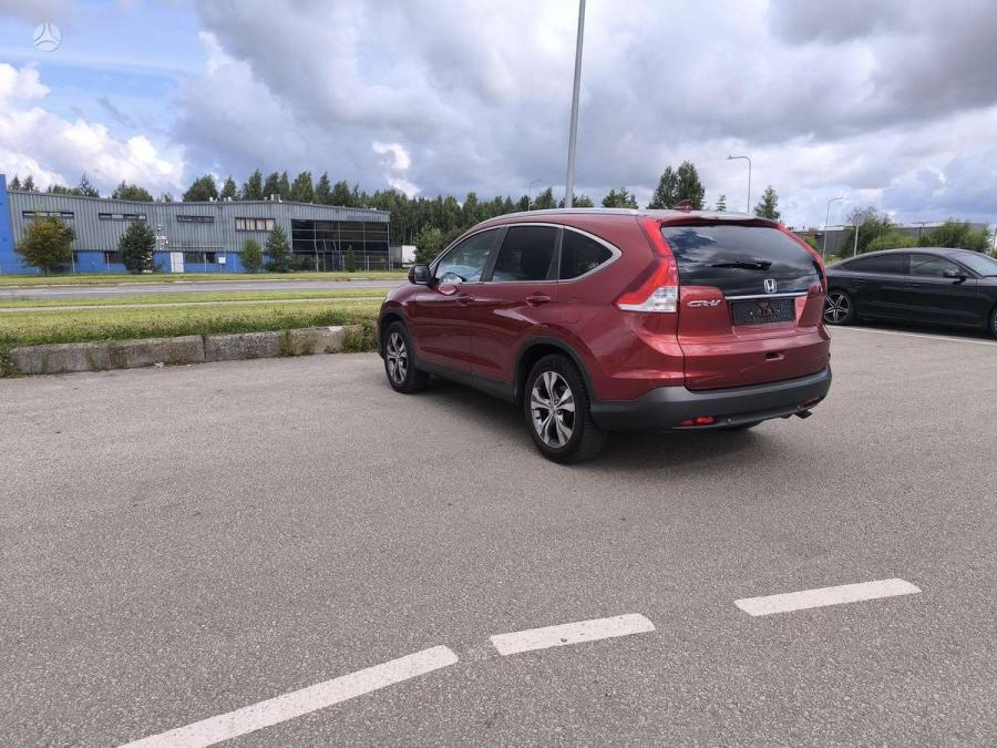Red Honda CR-V 2013 in Panevezys, with an engine capacity of 2.20 L and mileage of 225 thousand km for 8900 €, photo 12 on AUTOMOTO.COM.LV