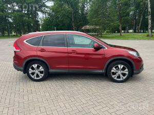 Red Honda CR-V 2014 in Riga, with an engine capacity of 1.60 L and mileage of 253 thousand km for 9300 €, photo 2 on AUTOMOTO.COM.LV