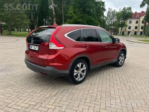 Red Honda CR-V 2014 in Riga, with an engine capacity of 1.60 L and mileage of 253 thousand km for 9300 €, photo 11 on AUTOMOTO.COM.LV