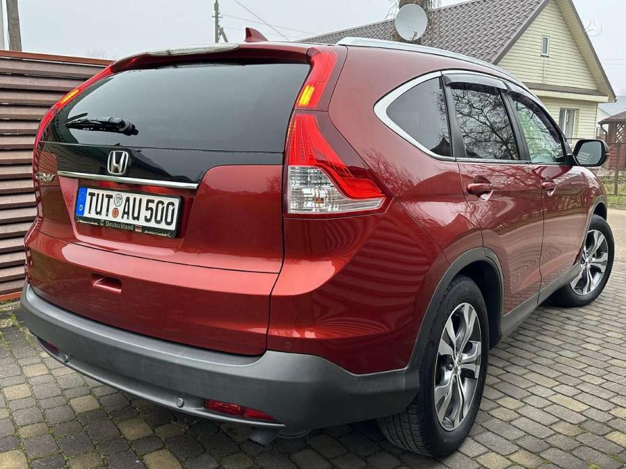 Red Honda CR-V 2014 in Vilnius, with an engine capacity of 1.60 L and mileage of 248 thousand km for 8850 €, photo 2 on AUTOMOTO.COM.LV