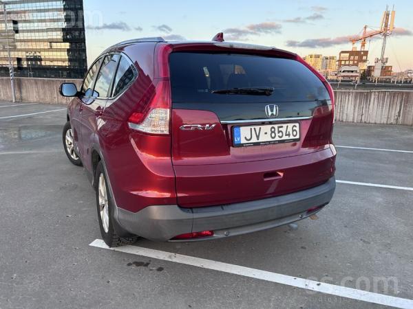 Red Honda CR-V 2014 in Riga, with an engine capacity of 2.20 L and mileage of 258 thousand km for 8900 €, photo 6 on AUTOMOTO.COM.LV