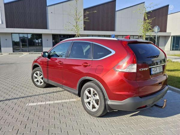 Red Honda CR-V 2014 in Vilnius, with an engine capacity of 2.20 L and mileage of 280 thousand km for 11999 €, photo 3 on AUTOMOTO.COM.LV