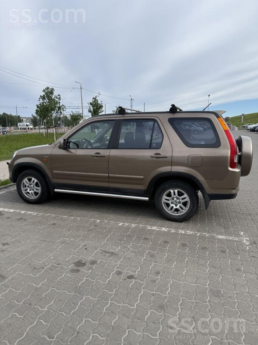 Yellow Honda CR-V 2002 in Riga, with an engine capacity of 2.00 L and mileage of 187 thousand km for 2400 €, photo 7 on AUTOMOTO.COM.LV