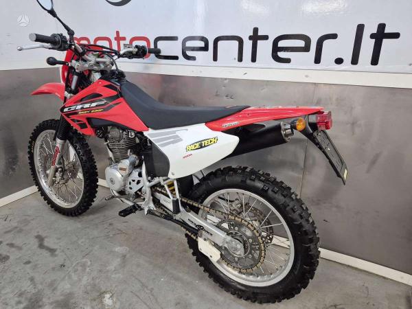 Red Honda CRF 2004 in Kaunas, with an engine capacity of 0.23 L and mileage of 0 thousand km for 2500 €, photo 4 on AUTOMOTO.COM.LV