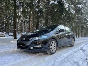 Black Honda Insight 2009 in Vilnius, with an engine capacity of 1.34 L and mileage of 274 thousand km for 1950 €, photo  on AUTOMOTO.COM.LV