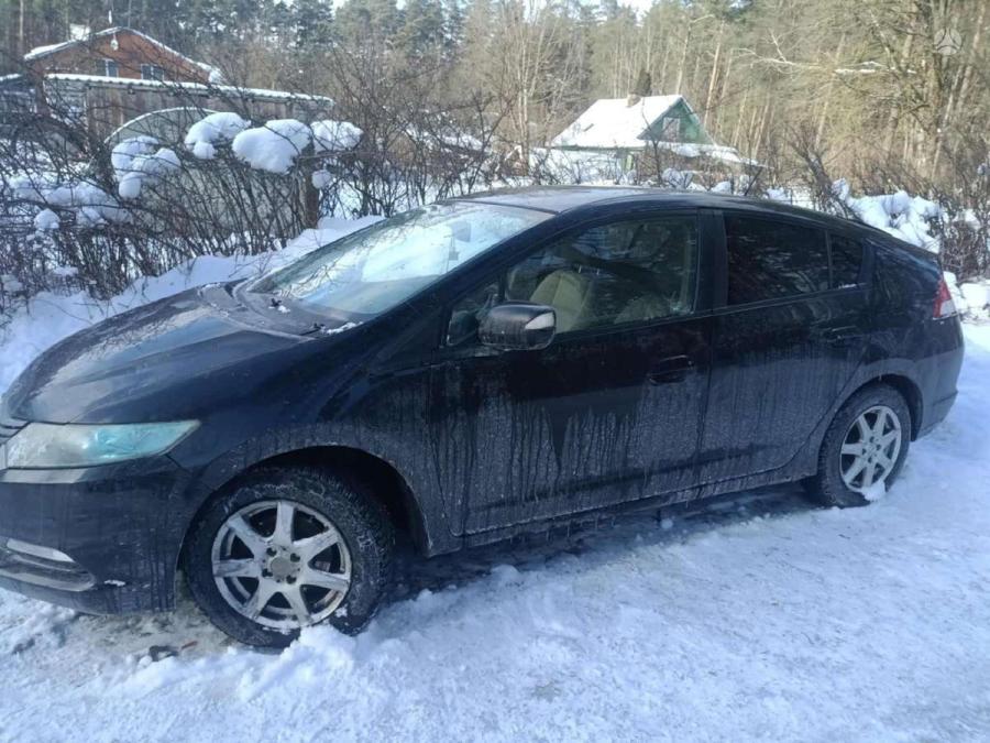 Black Honda Insight 2009 in Vilnius, with an engine capacity of 1.34 L and mileage of 265 thousand km for 1500 €, photo 1 on AUTOMOTO.COM.LV