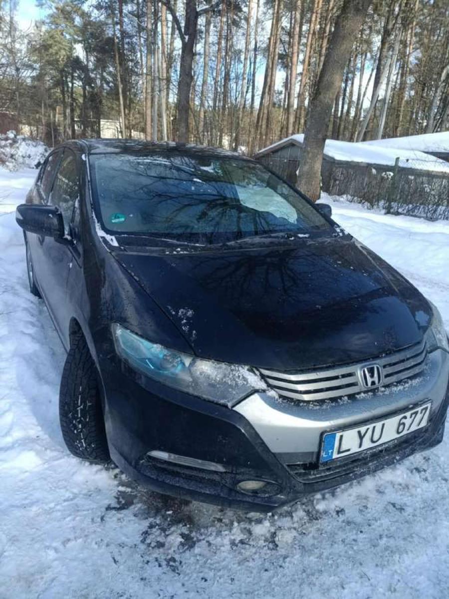 Black Honda Insight 2009 in Vilnius, with an engine capacity of 1.34 L and mileage of 265 thousand km for 1500 €, photo 7 on AUTOMOTO.COM.LV