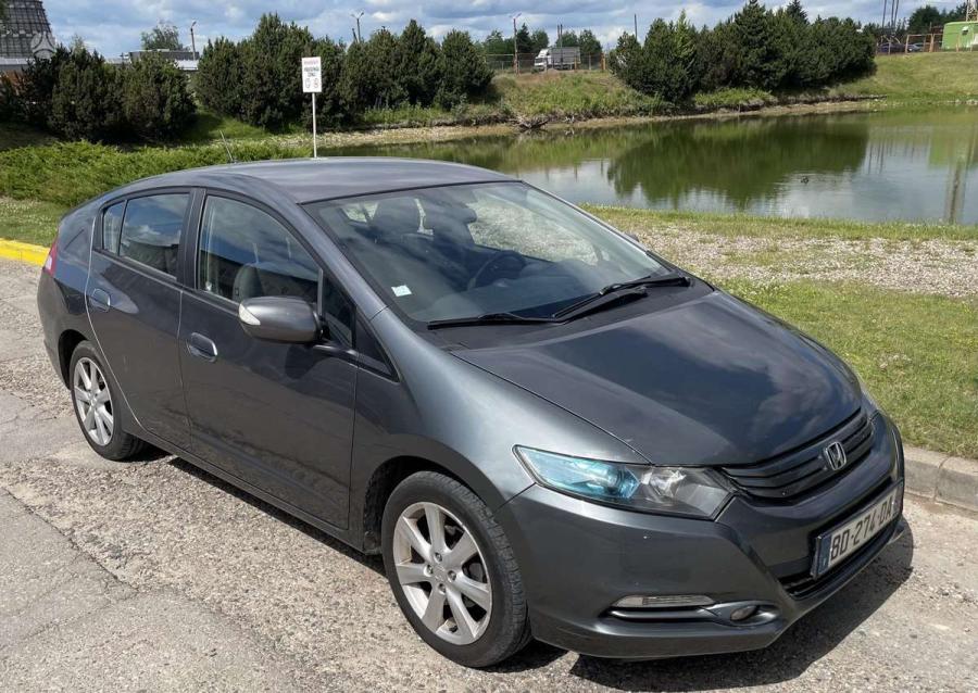 Brown Honda Insight 2010 in Vilnius, with an engine capacity of 1.34 L and mileage of 279 thousand km for 3750 €, photo 1 on AUTOMOTO.COM.LV