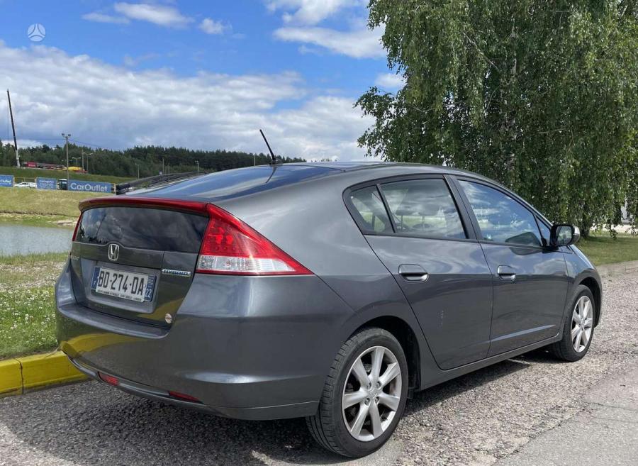 Brown Honda Insight 2010 in Vilnius, with an engine capacity of 1.34 L and mileage of 279 thousand km for 3650 €, photo 6 on AUTOMOTO.COM.LV