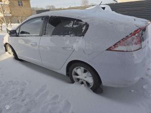 White Honda Insight 2010 in Kretinga, with an engine capacity of 1.34 L and mileage of 237 thousand km for 2000 €, photo 4 on AUTOMOTO.COM.LV