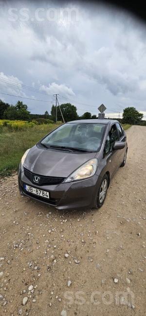 Grey Honda Jazz 2012 in Riga, with an engine capacity of 1.60 L and mileage of 238 thousand km for 1600 €, photo  on AUTOMOTO.COM.LV