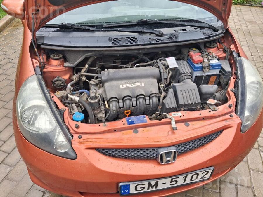 Orange Honda Jazz 2007 in Saldus, with an engine capacity of 1.40 L and mileage of 191 thousand km for 1450 €, photo 7 on AUTOMOTO.COM.LV