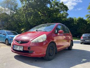 Red Honda Jazz 2004 in Vilnius, with an engine capacity of 1.34 L and mileage of 129 thousand km for 550 €, photo 13 on AUTOMOTO.COM.LV