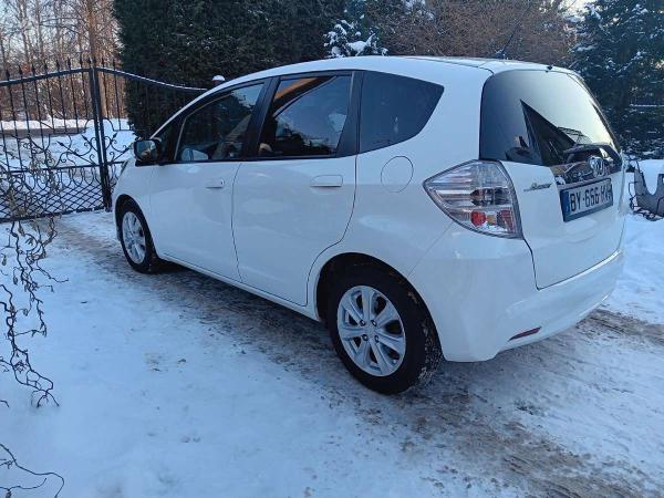 White Honda Jazz 2011 in Panevezys, with an engine capacity of 1.34 L and mileage of 200 thousand km for 5250 €, photo 7 on AUTOMOTO.COM.LV