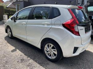 White Honda Jazz 2016 in Panevezys, with an engine capacity of 1.40 L and mileage of 58 thousand km for 2900 €, photo 5 on AUTOMOTO.COM.LV