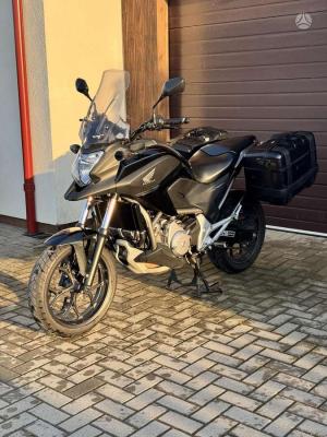 Black Honda NC 2013 in Panevezys, with an engine capacity of 0.70 L and mileage of 30 thousand km for 3900 €, photo  on AUTOMOTO.COM.LV