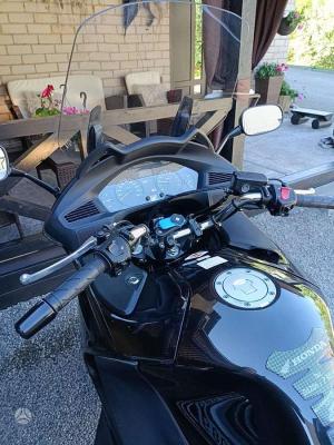 Melns Honda NT 2006 Lazdijai, ar dzinēja tilpumu 0.70 L un nobraukumu 56 tūkst. km par 3850 €, foto  vietnē AUTOMOTO.COM.LV