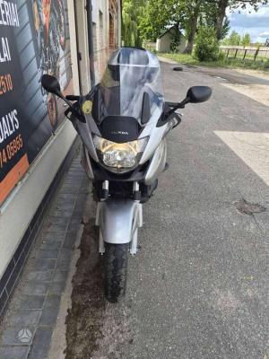 Grey Honda NT 2014 in Panevezys, with an engine capacity of 0.70 L and mileage of 21 thousand km for 4200 €, photo 6 on AUTOMOTO.COM.LV