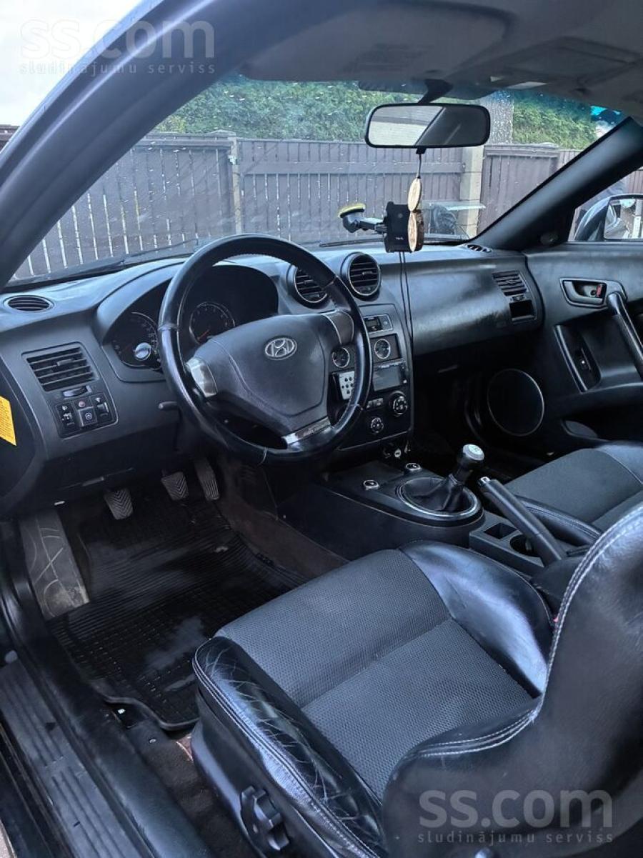Melns Hyundai Coupe 2007 Rīga, ar dzinēja tilpumu 2.00 L un nobraukumu 204 tūkst. km par 3200 €, foto 12 vietnē AUTOMOTO.COM.LV