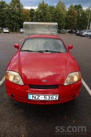 Red Hyundai Coupe 2004 in Riga, with an engine capacity of 2.00 L and mileage of 213 thousand km for 800 €, photo  on AUTOMOTO.COM.LV