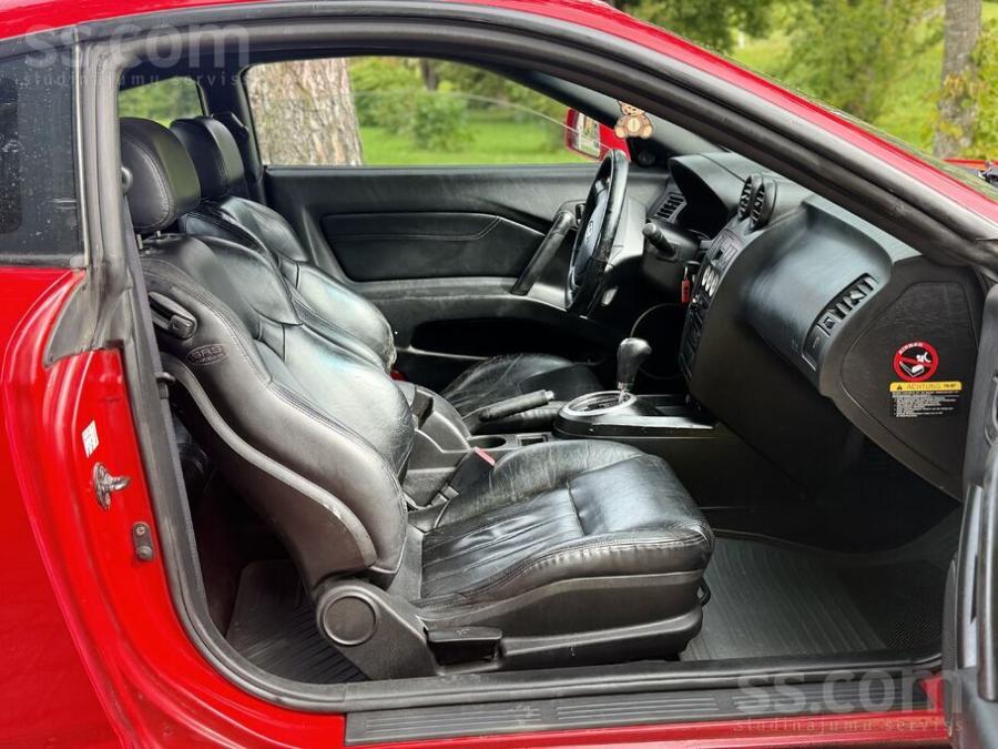 Red Hyundai Coupe 2004 in Cesis, with an engine capacity of 2.00 L and mileage of 214 thousand km for 1600 €, photo 7 on AUTOMOTO.COM.LV