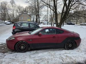 Red Hyundai Coupe 2007 in Riga, with an engine capacity of 2.00 L and mileage of 269 thousand km for 450 €, photo 5 on AUTOMOTO.COM.LV