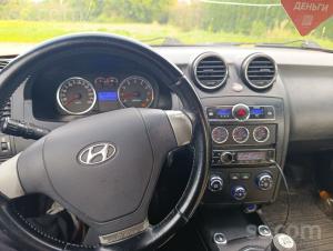Sarkans Hyundai Coupe 2007 Rīga, ar dzinēja tilpumu 2.00 L un nobraukumu 257 tūkst. km par 1600 €, foto 10 vietnē AUTOMOTO.COM.LV