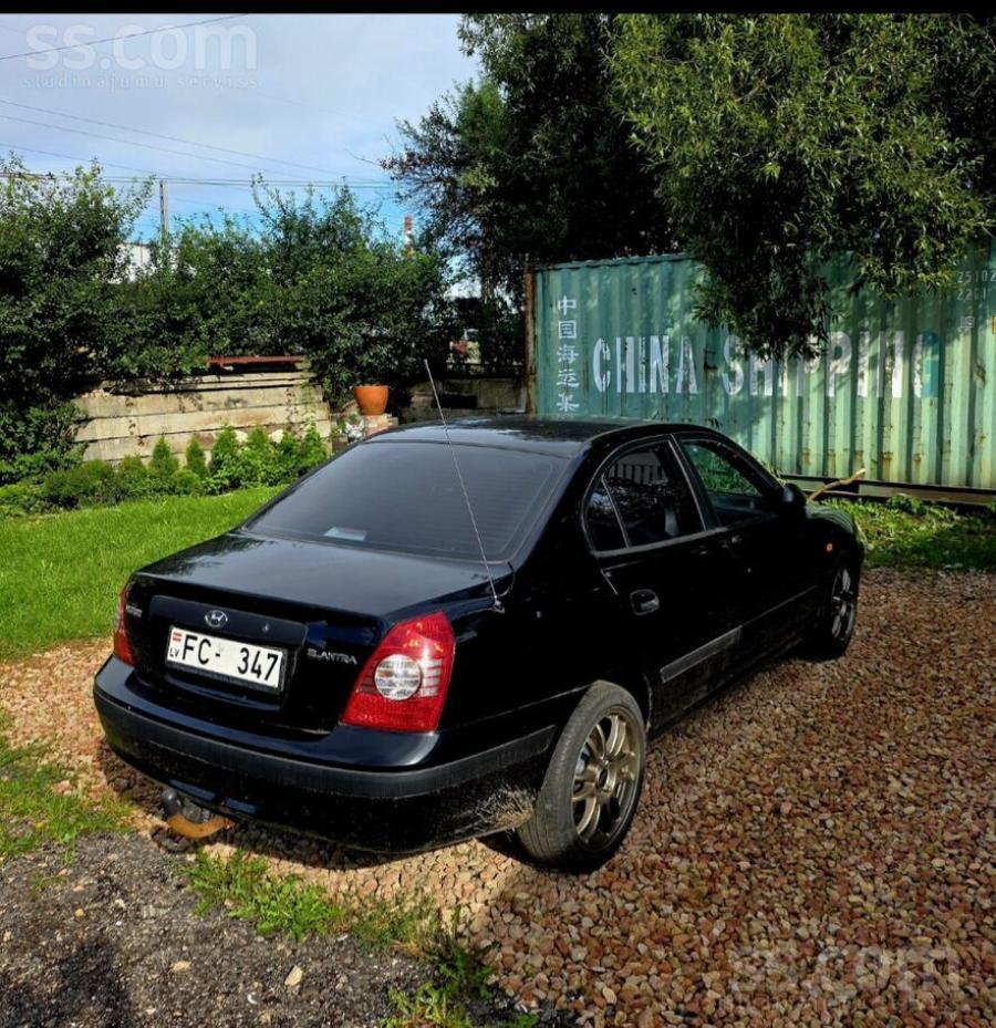Black Hyundai Elantra 2004 in Riga, with an engine capacity of 1.60 L and mileage of 206 thousand km for 3200 €, photo 17 on AUTOMOTO.COM.LV