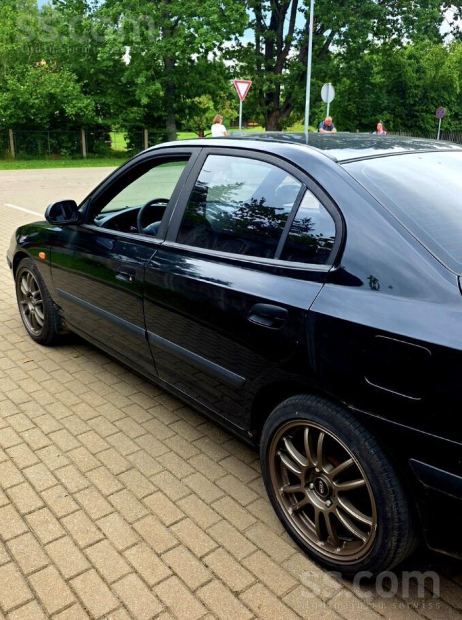 Black Hyundai Elantra 2004 in Riga, with an engine capacity of 1.60 L and mileage of 206 thousand km for 3200 €, photo 18 on AUTOMOTO.COM.LV