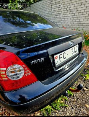 Black Hyundai Elantra 2004 in Riga, with an engine capacity of 1.60 L and mileage of 206 thousand km for 3200 €, photo 19 on AUTOMOTO.COM.LV