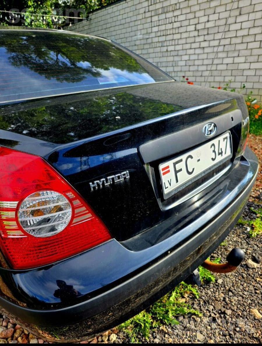 Black Hyundai Elantra 2004 in Riga, with an engine capacity of 1.60 L and mileage of 206 thousand km for 3200 €, photo 19 on AUTOMOTO.COM.LV