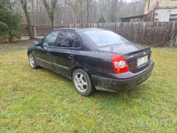 Black Hyundai Elantra 2006 in Riga, with an engine capacity of 1.60 L and mileage of 152 thousand km for 1100 €, photo 5 on AUTOMOTO.COM.LV