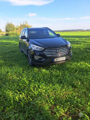 Black Hyundai Grand Santa Fe 2014 in Skaudvile, with an engine capacity of 2.20 L and mileage of 243 thousand km for 12500 €, photo 2 on AUTOMOTO.COM.LV