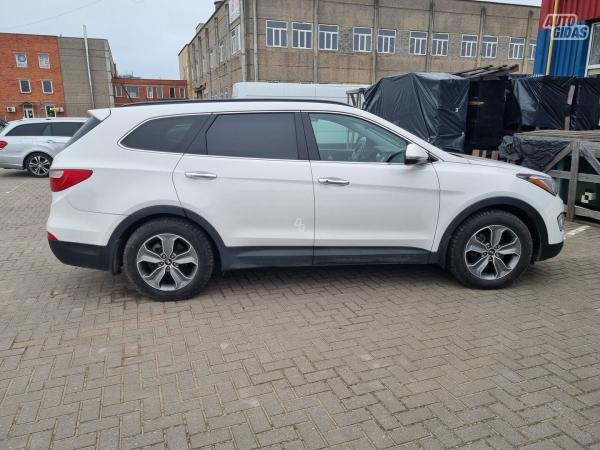 Balts Hyundai Grand Santa Fe 2015 Alīta, ar dzinēja tilpumu 3.30 L un nobraukumu 84 tūkst. km par 13150 €, foto 3 vietnē AUTOMOTO.COM.LV
