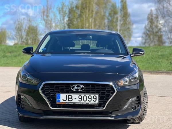 Black Hyundai i30 2018 in Riga, with an engine capacity of 1.40 L and mileage of 56 thousand km for 12900 €, photo 6 on AUTOMOTO.COM.LV