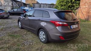Brown Hyundai i30 2014 in Liepaja, with an engine capacity of 1.40 L and mileage of 203 thousand km for 2850 €, photo 6 on AUTOMOTO.COM.LV