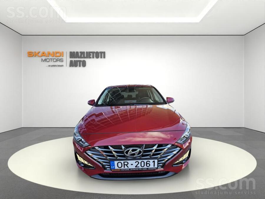 Red Hyundai i30 2021 in Liepaja, with an engine capacity of 1.50 L and mileage of 76 thousand km for 13490 €, photo 3 on AUTOMOTO.COM.LV