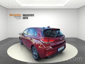 Red Hyundai i30 2021 in Liepaja, with an engine capacity of 1.50 L and mileage of 76 thousand km for 13490 €, photo 5 on AUTOMOTO.COM.LV