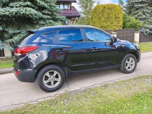 Black Hyundai ix35 2011 in Panevezys, with an engine capacity of 1.69 L and mileage of 265 thousand km for 5100 €, photo 6 on AUTOMOTO.COM.LV